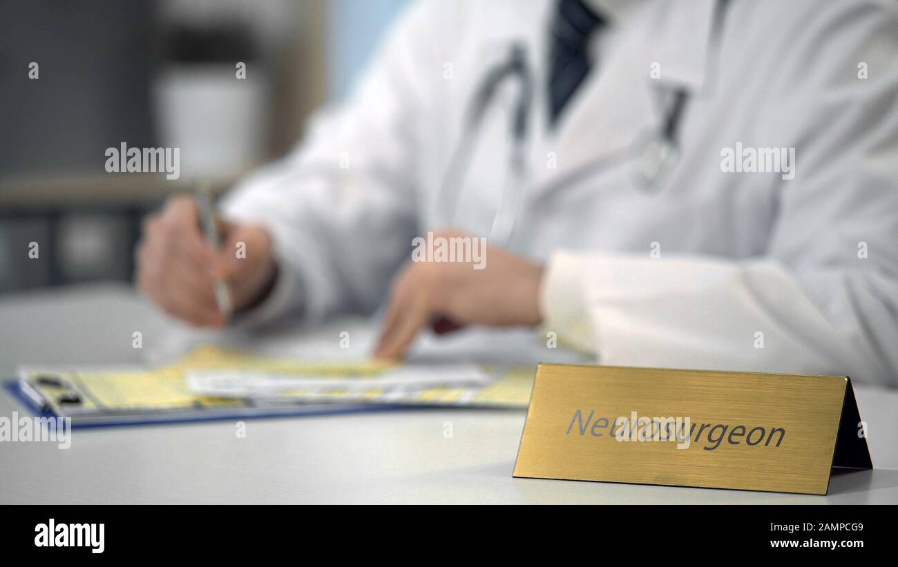 Neurosurgeon typing medical records on hi-res stock photography and ...
