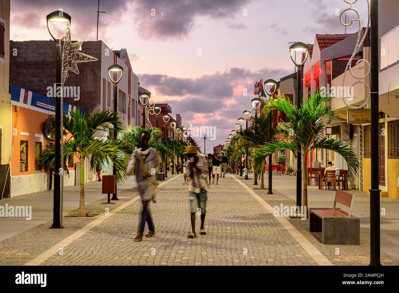 Pedestrian zone with poinsettia in the evening, Santa Maria, Sal Island ...