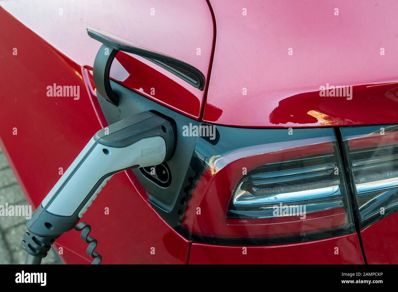 Tesla Model S. Plugged into charging port, in The Hague, The ...