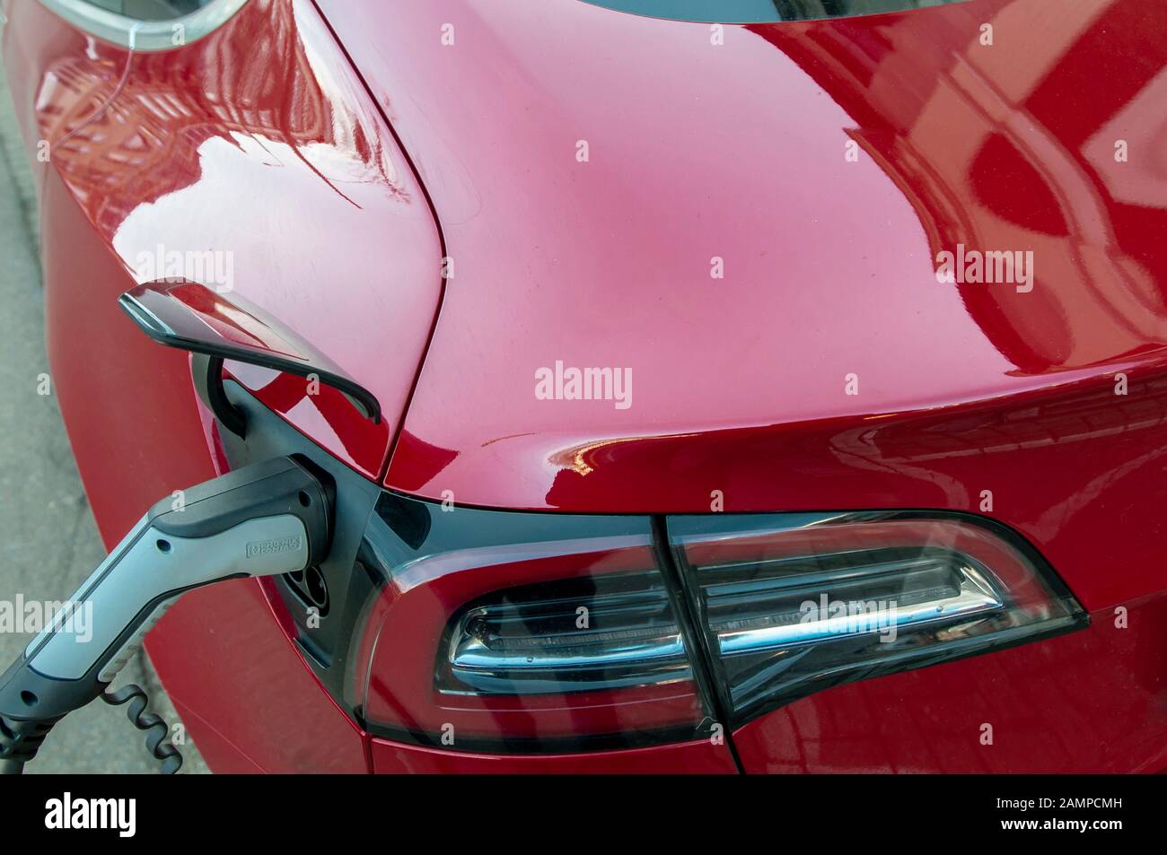 Tesla Model S. Plugged into charging port, in The Hague, The ...