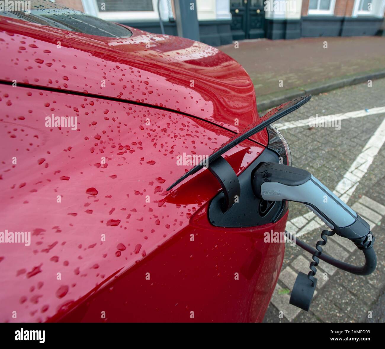 Tesla Model S. Plugged into charging port, in The Hague, The ...
