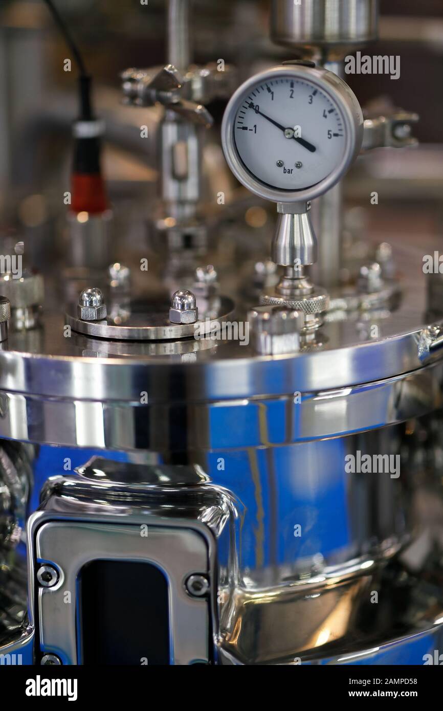 Stainless steel pharmaceutical reactor with analog pressure gauge Stock ... Stainless steel pharmaceutical reactor with analog pressure gauge Stock ...