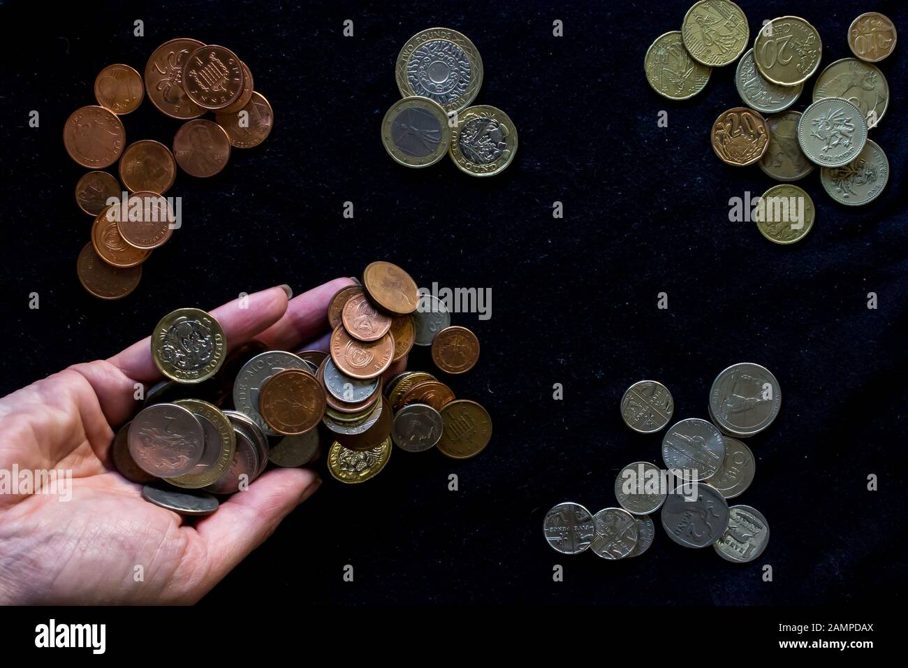 Piles of various types of coins of different shapes sizes and from ...