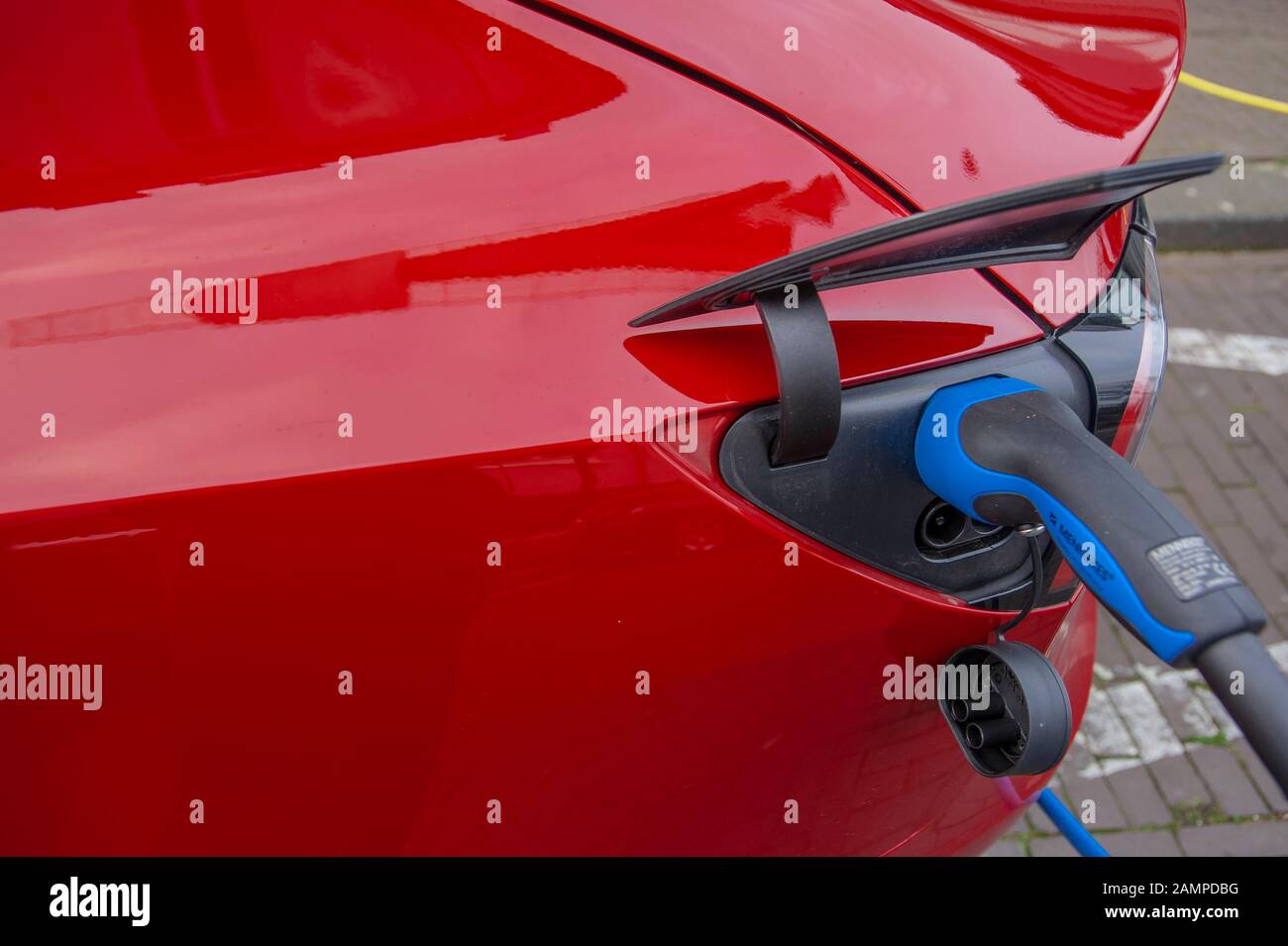 Tesla Model S. Plugged into charging port, in The Hague, The ...