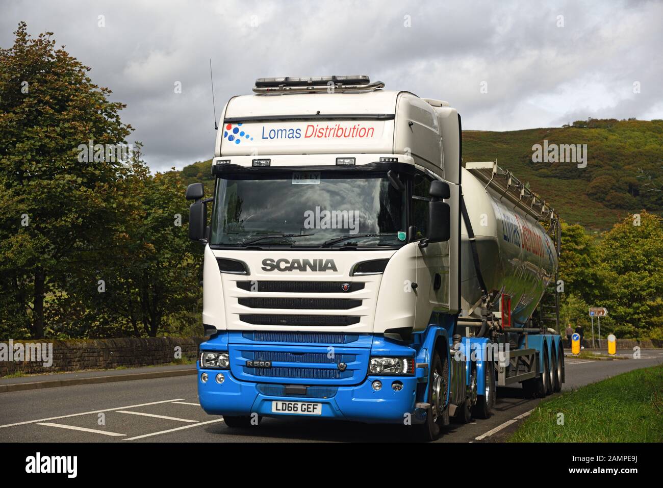 Lomas Group Scania cement tanker driving past Ladybower Reservoir in ...