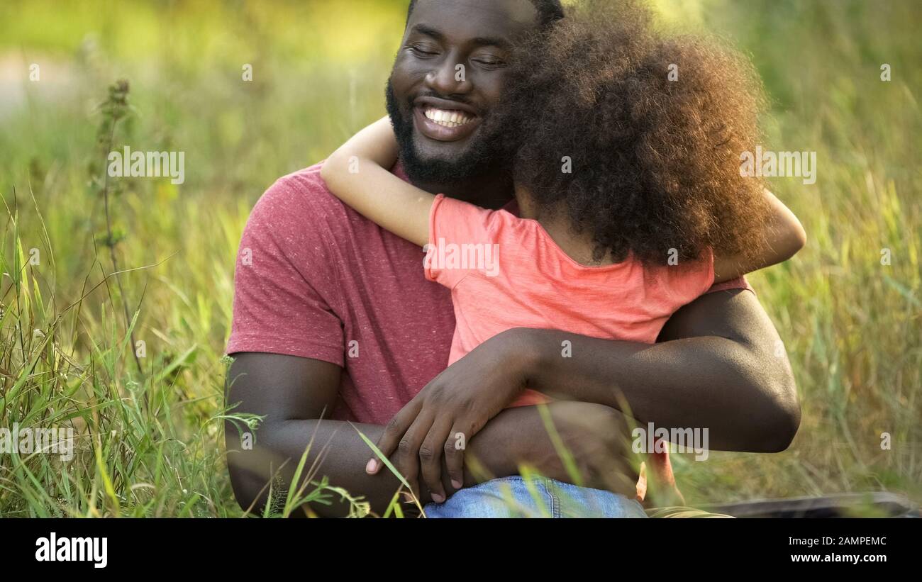 Happiest father on Earth embracing cherished daughter in tight and ...