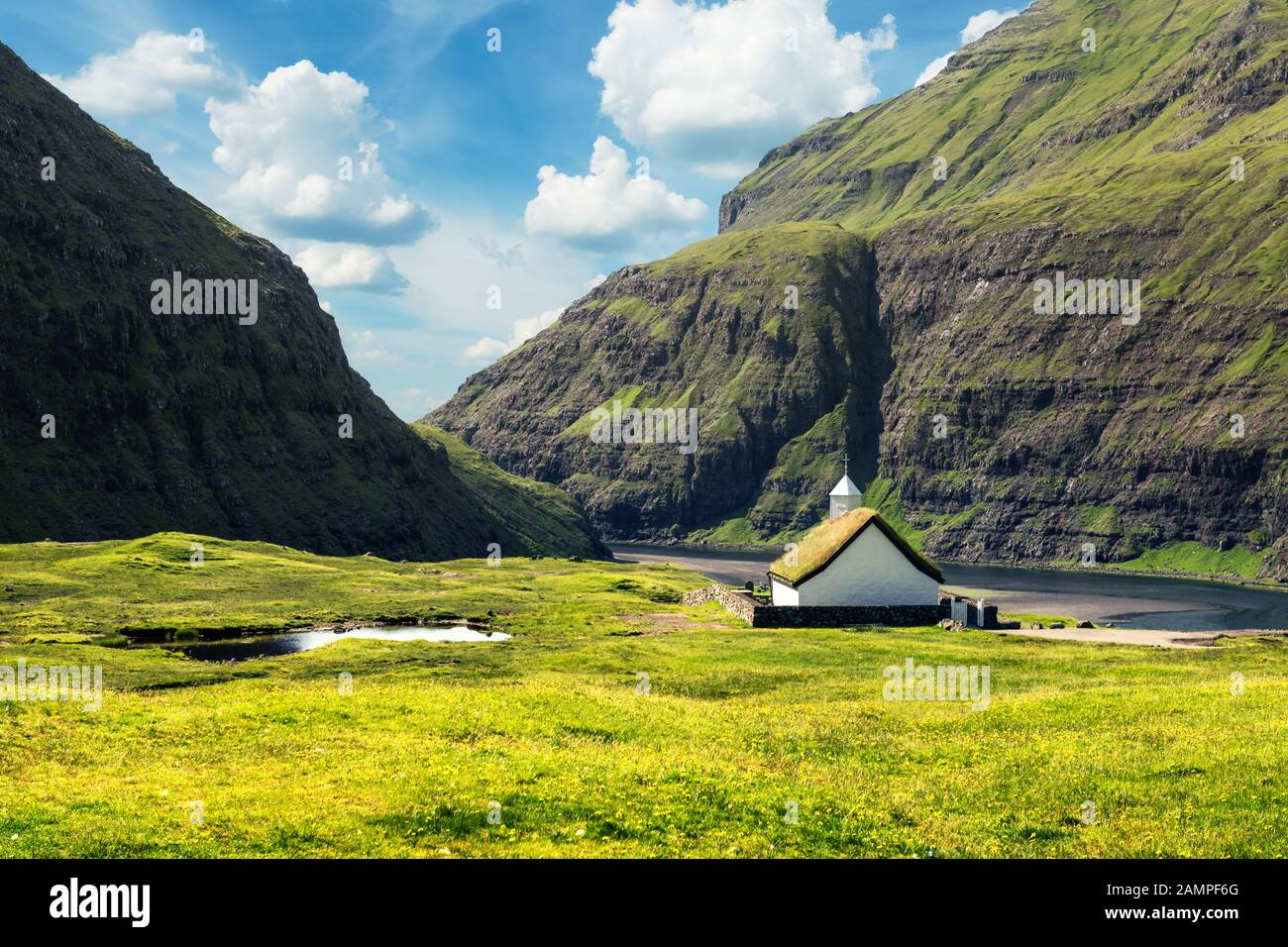 Summer view of traditional turf-top church Saksunar Kirkja in Saksun ...