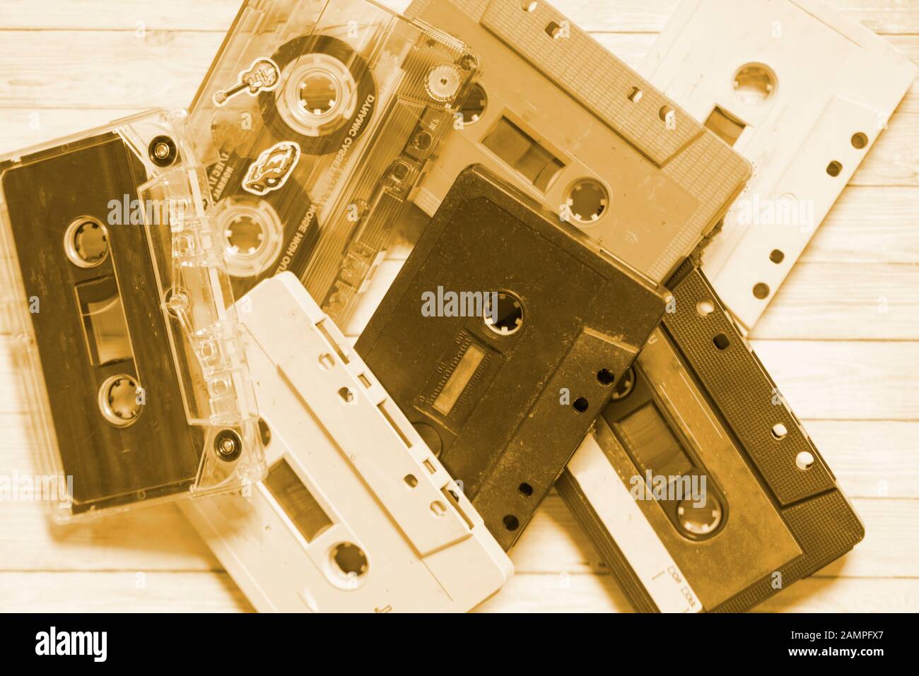 Old cassette tapes with a wooden background Stock Photo - Alamy