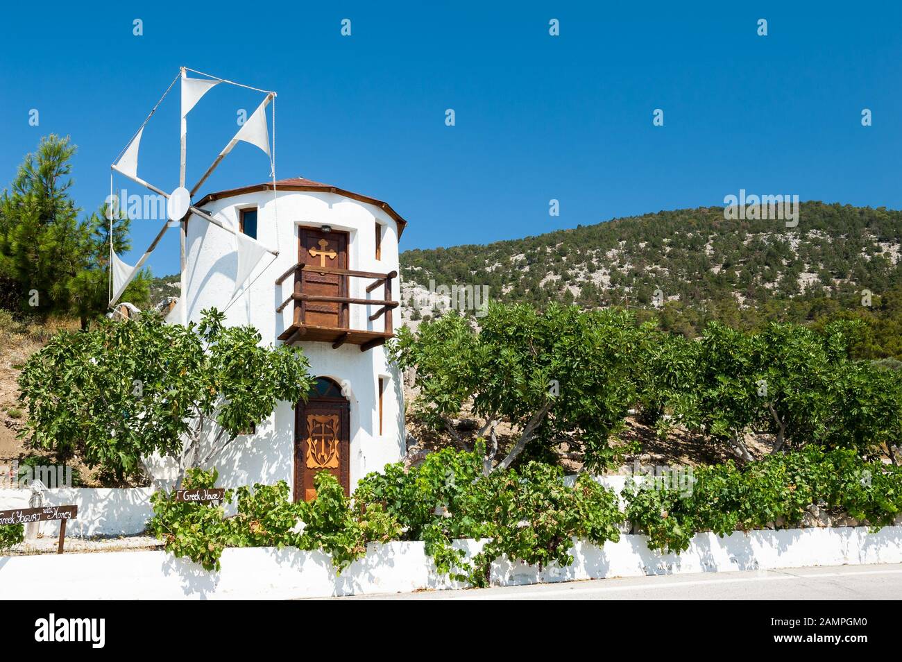 Old windmill turned into traditional greek restaurant in Monolithos ...