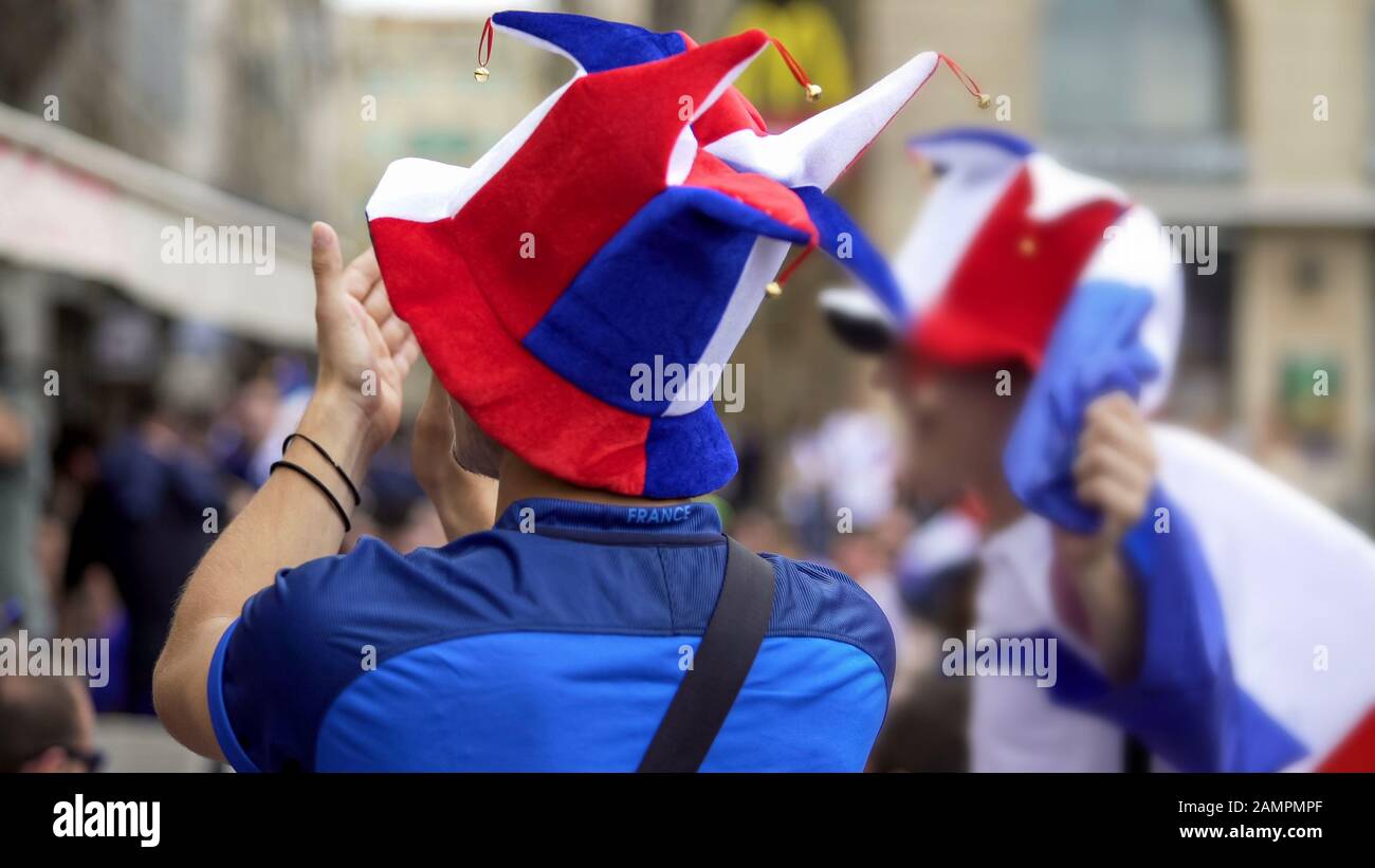 Fan of French soccer clapping hands, proud of favorite team, winning ...