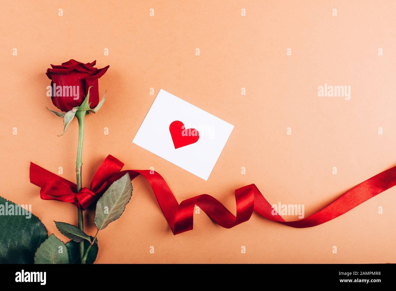 Red rose with message card Stock Photo - Alamy