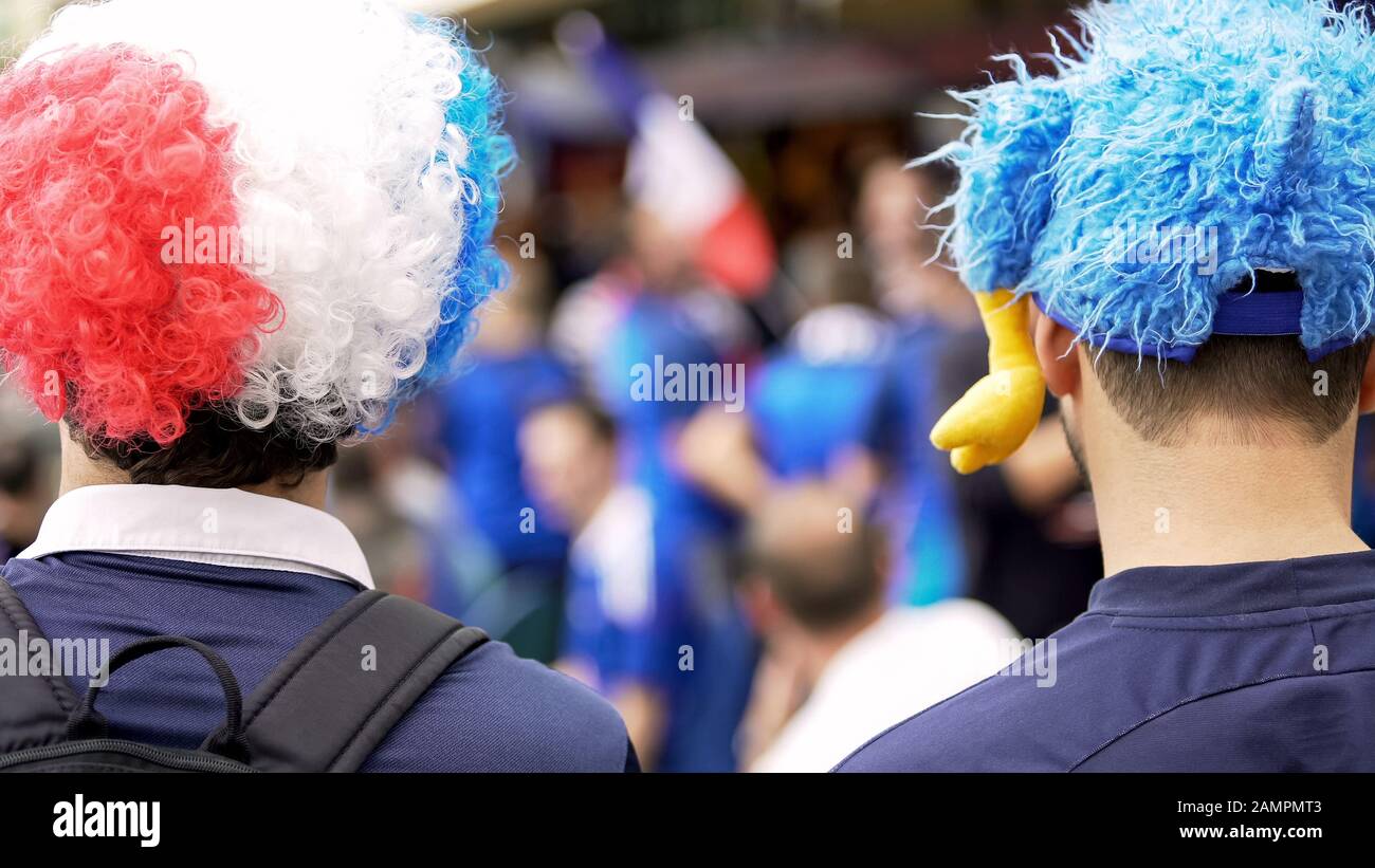 French supporters in funny hats with mascots supporting national soccer ...