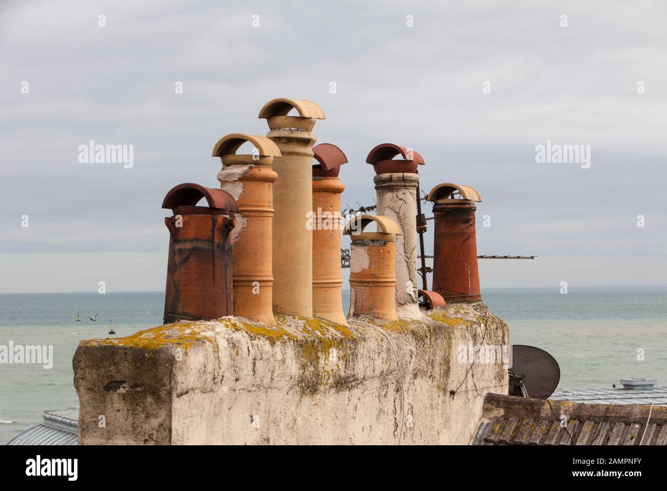 Variety of old, odd chimneys on a roof, UK Stock Photo - Alamy