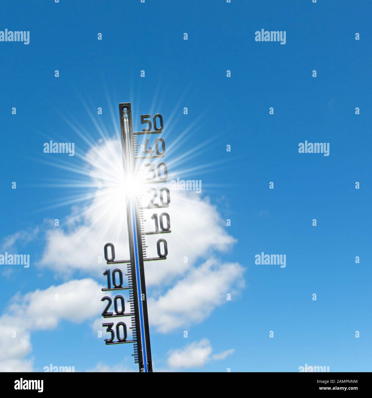 Thermometer in front of sky with clouds Stock Photo - Alamy