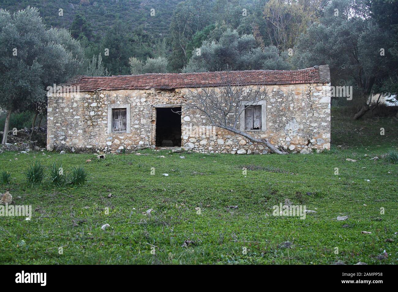 An old house built with bricks and stone A simple village architecture ...