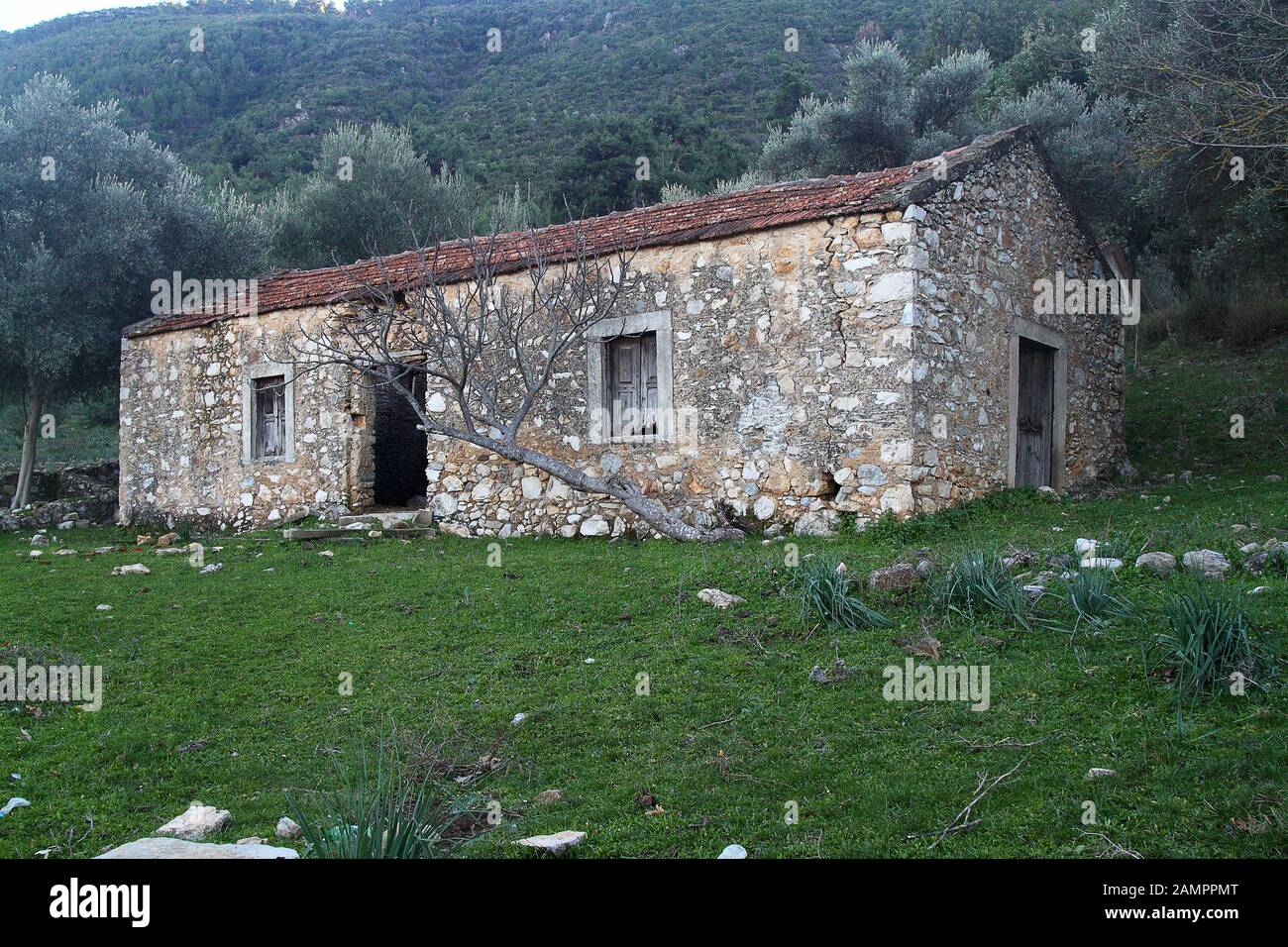 An old house built with bricks and stone A simple village architecture ...