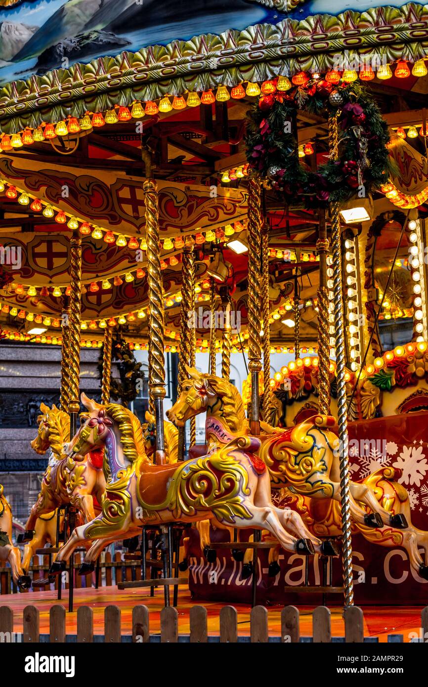 Yellow Vintage merry-go-round wooden horses in carusel Stock Photo - Alamy