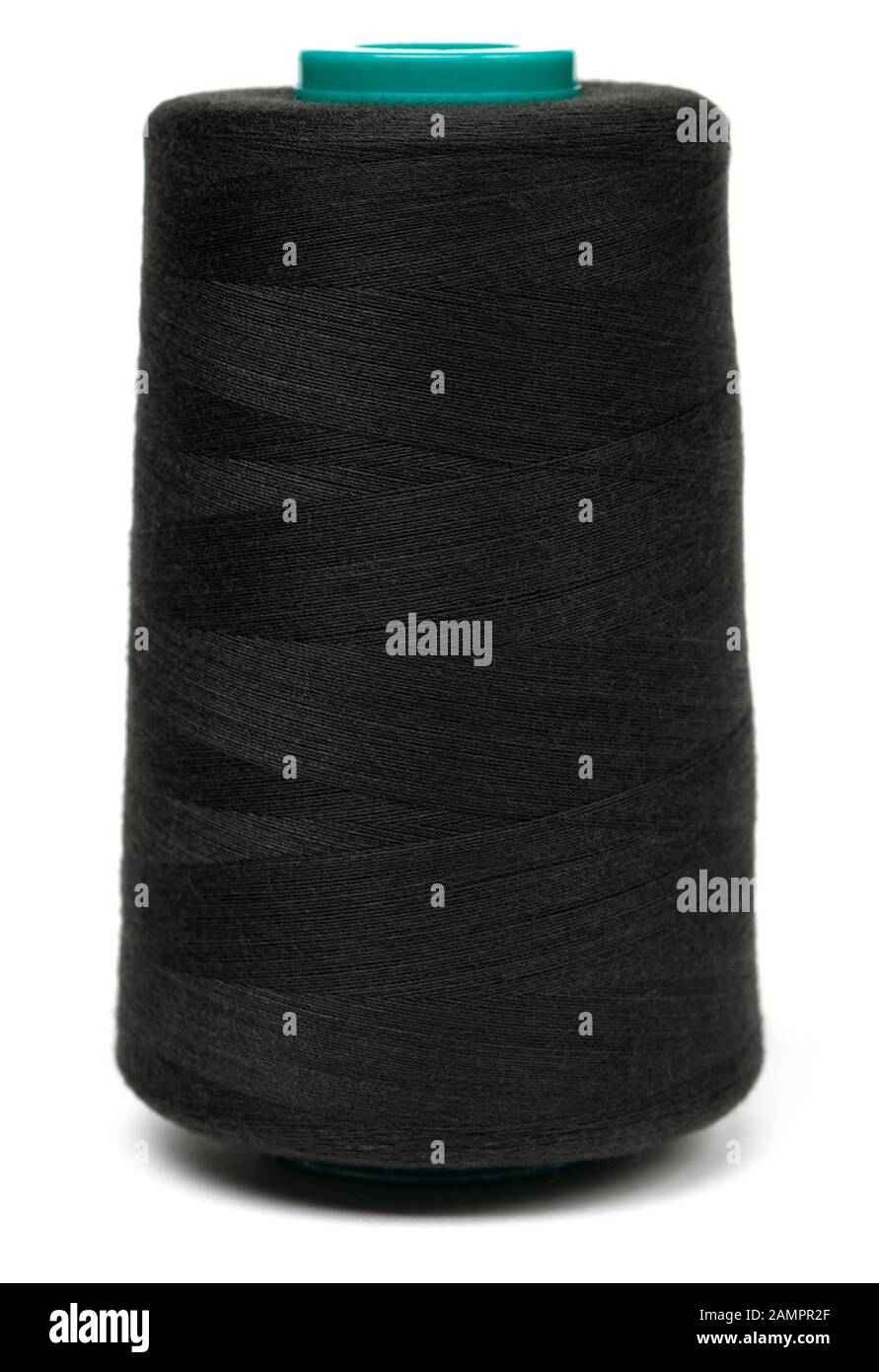 Spool of black synthetic or cotton threads isolated on white background ...