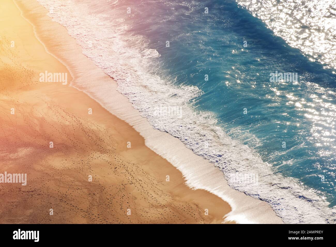 Top view of beautiful empty sand beach with waves, sunny toned photo ...