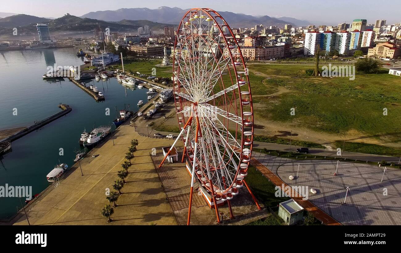 Panoramic wheel at seaside, amusement park in Georgia, Batumi ...