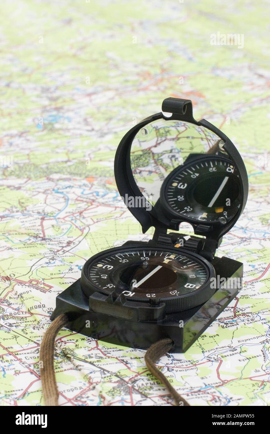 Navigation with compass and map Stock Photo - Alamy