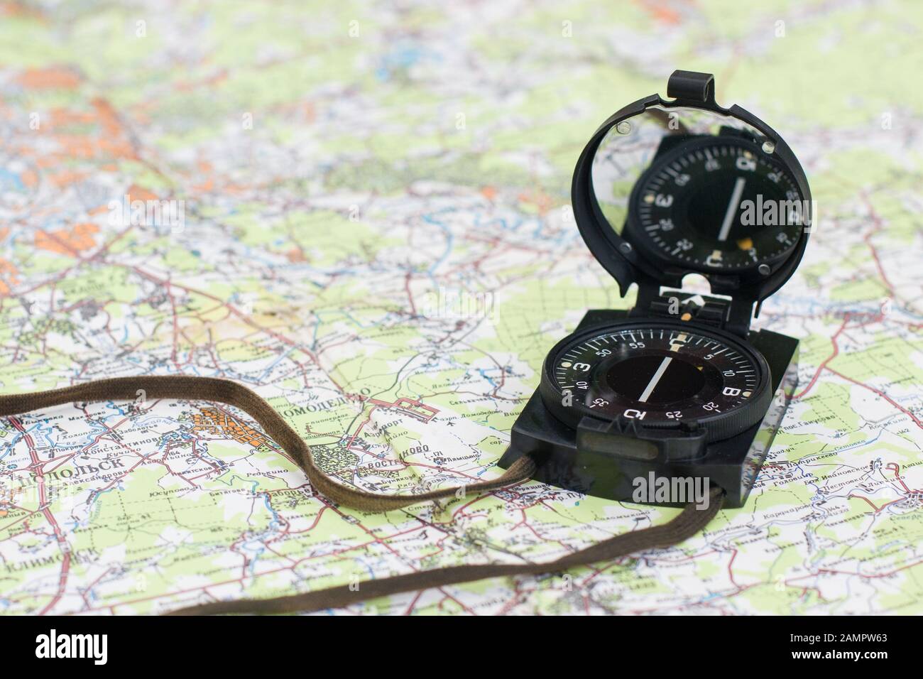 Navigation with compass and map Stock Photo - Alamy