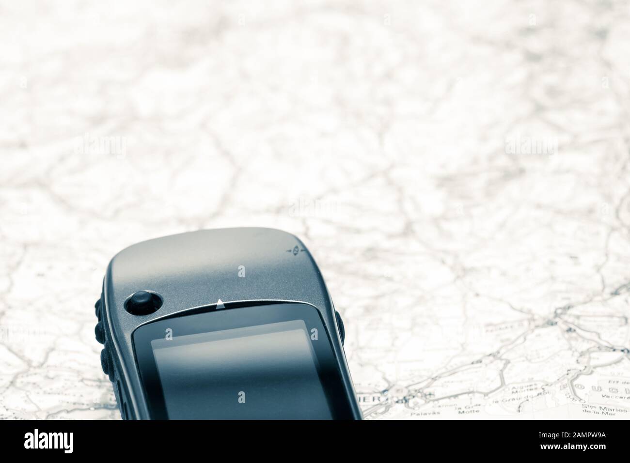 Hand-held GPS navigator on a map Stock Photo - Alamy