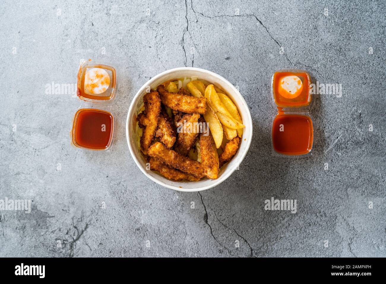 Take Away Fish and Chips made with Breaded and Fried Seabass in Plastic ...