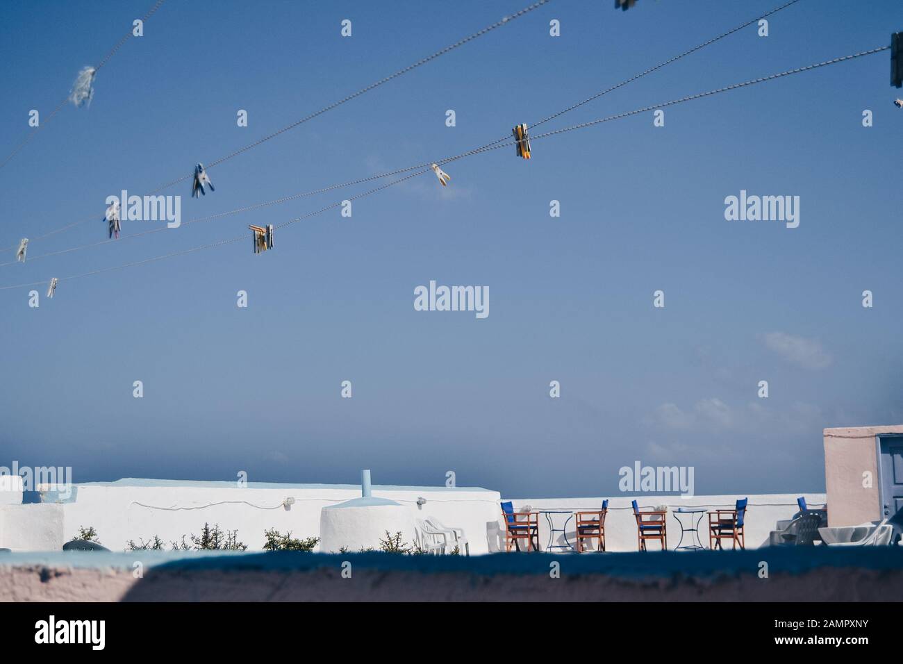 Clothes sticks hanging in a terrace Stock Photo - Alamy