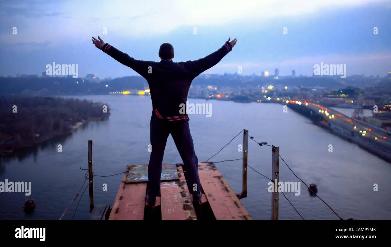 Man rising hands hi-res stock photography and images - Alamy