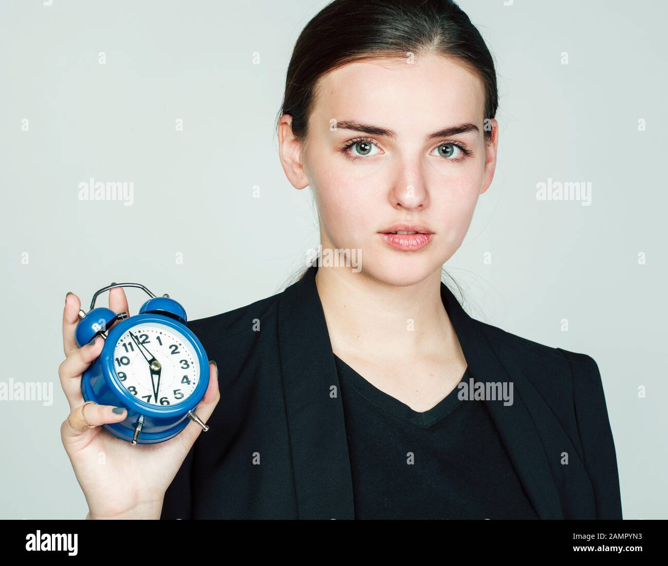 young beauty woman in business style costume waking up for work early ...