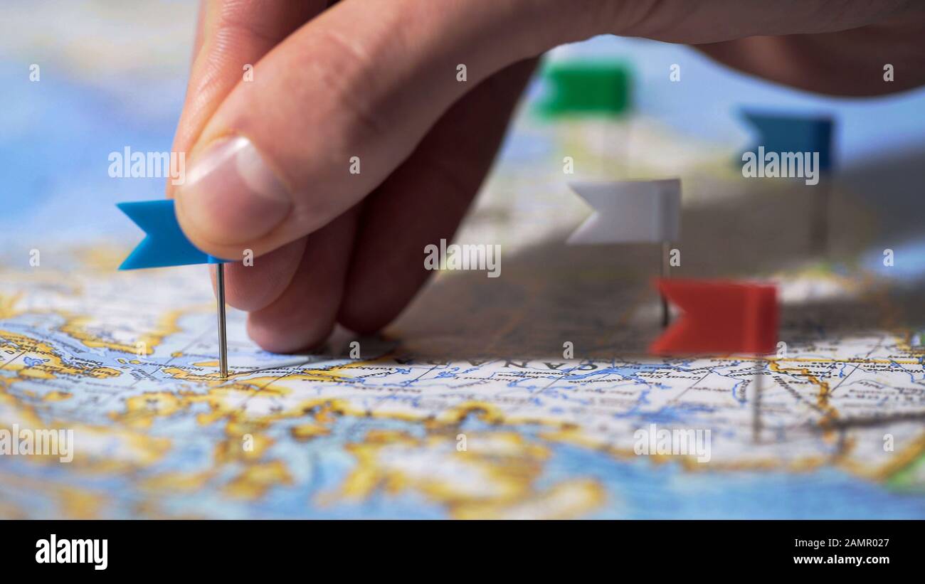Hand making pin mark on Canada map, travel destination, company branch ...