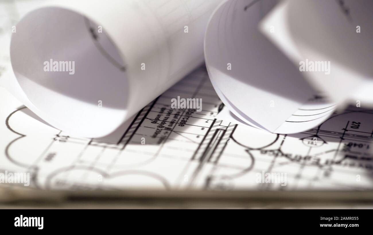 Rolled up building plan documents, architecture design, construction ...