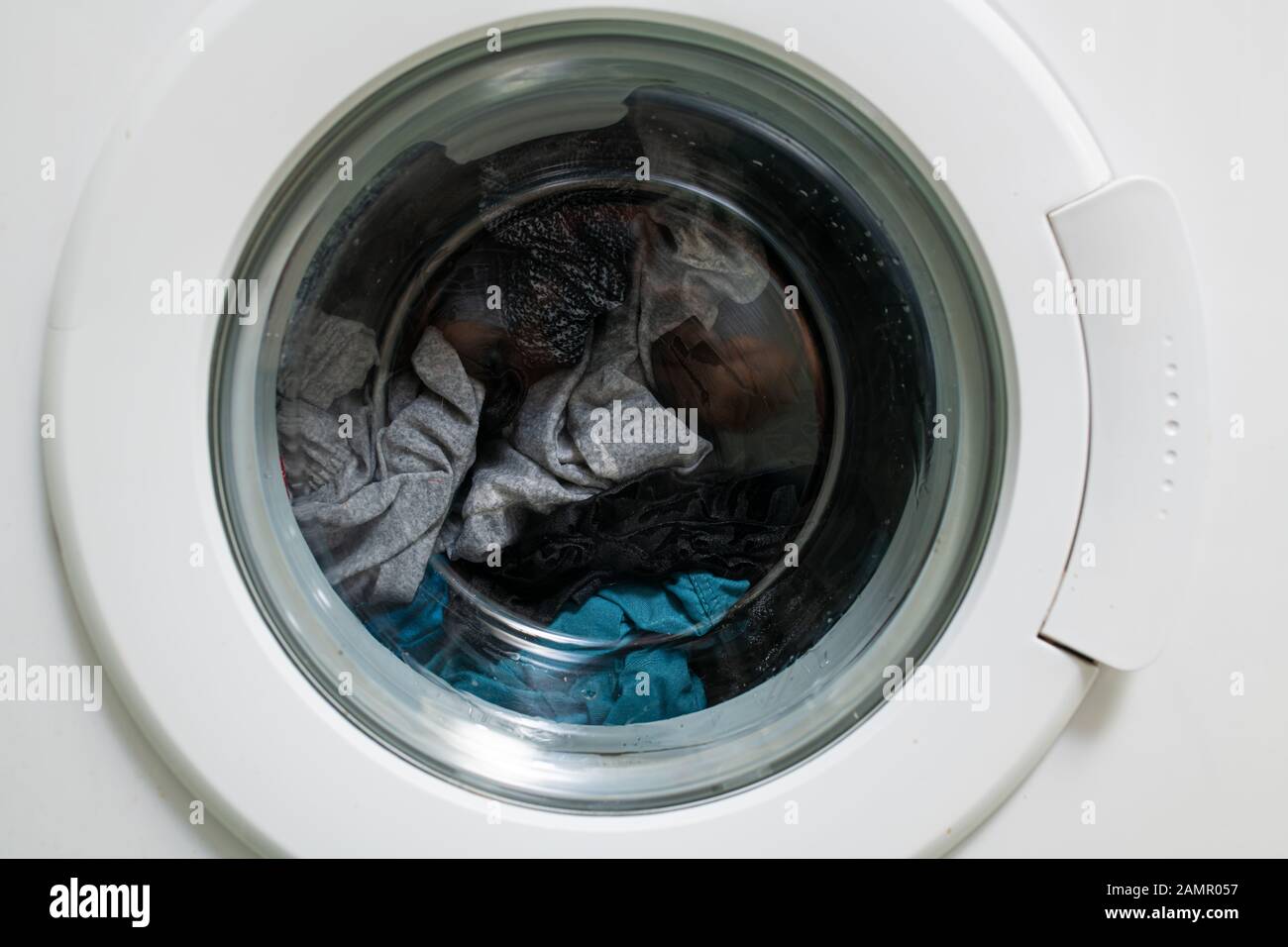 Pile of dirty clothes ready to be washed in the washing machine Stock ...