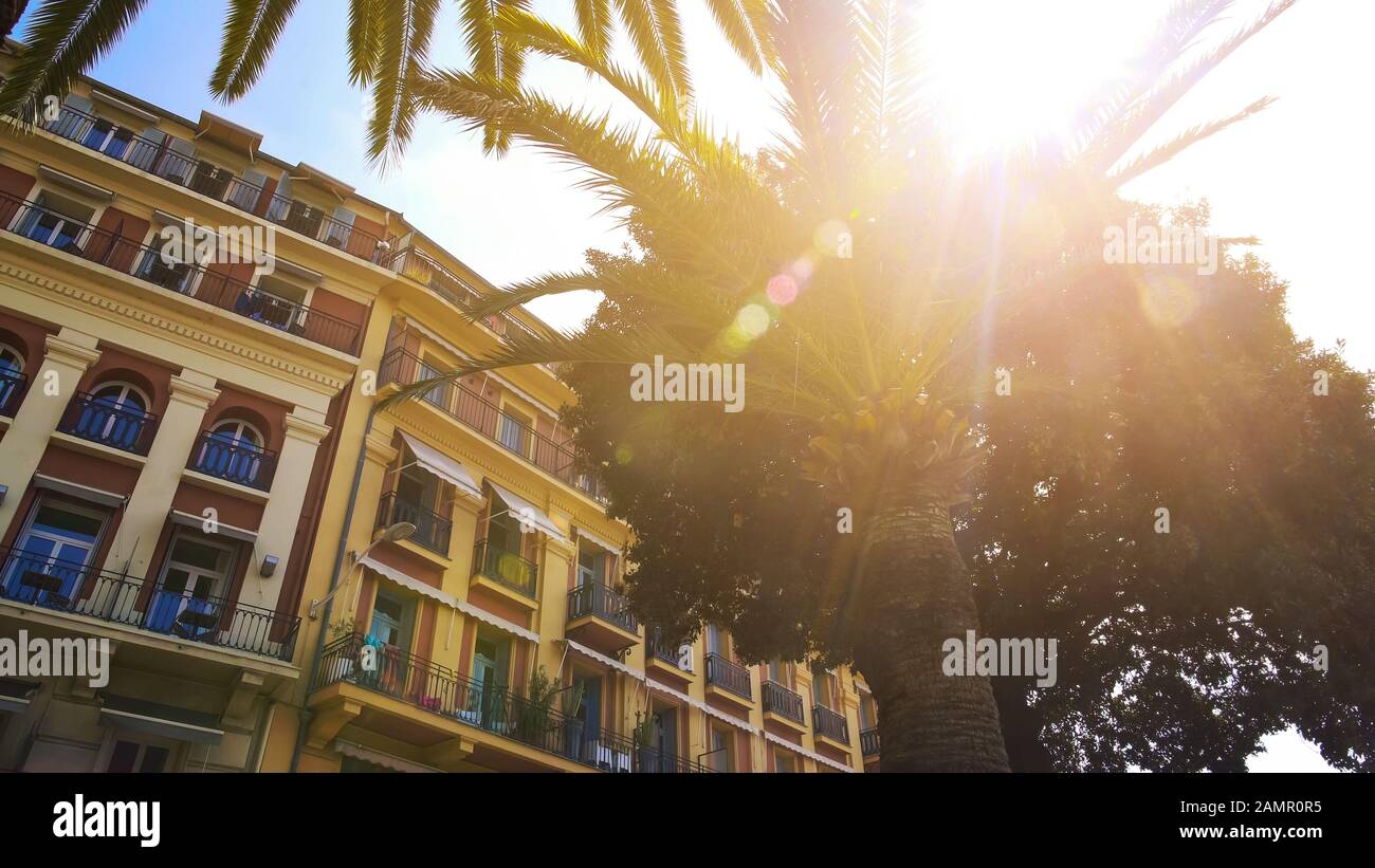 Beautiful hotel building and palm trees in resort city, summer vacation ...
