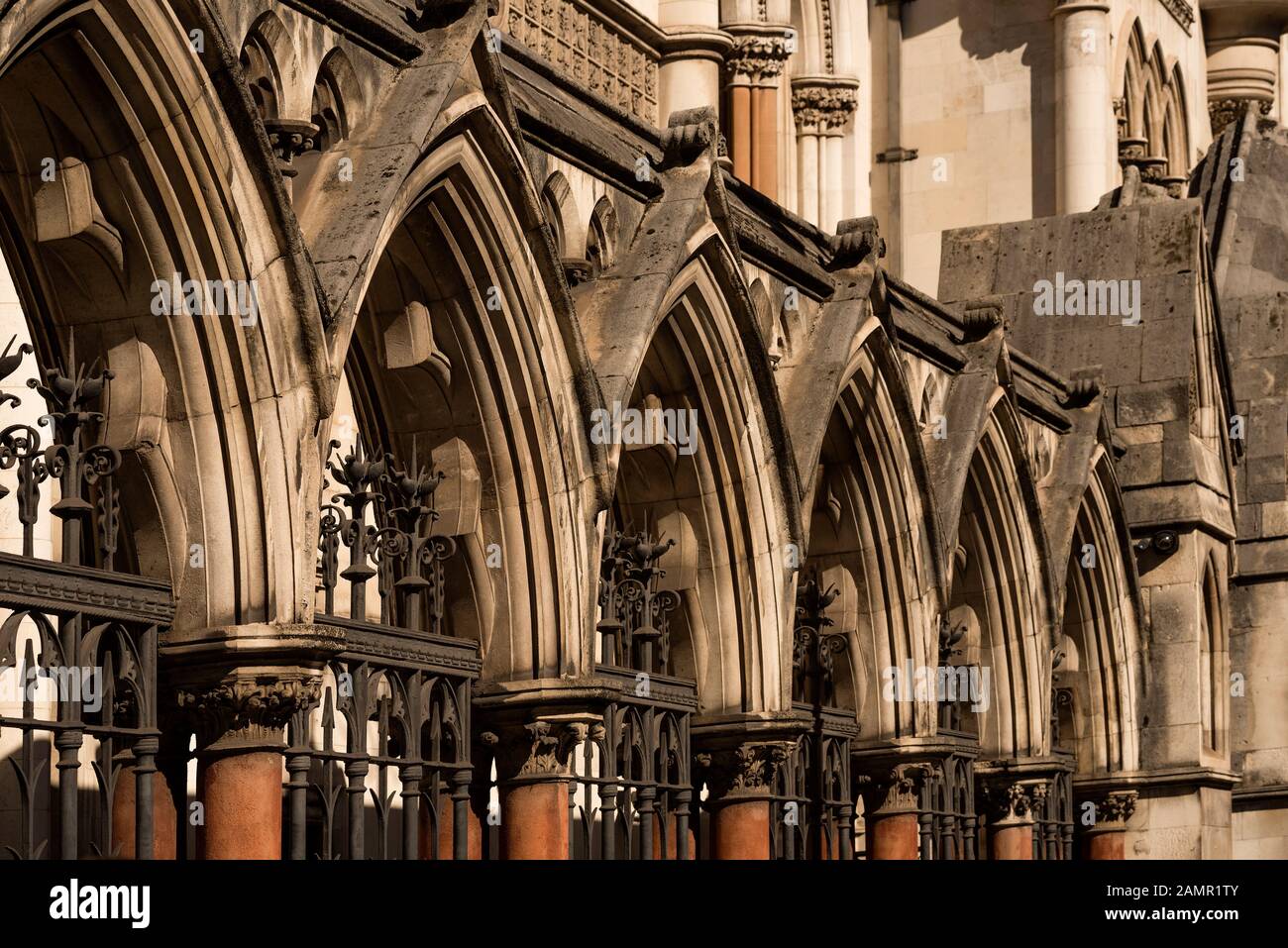 The gothic arches at the front of The Royal Courts of Justice in London ...