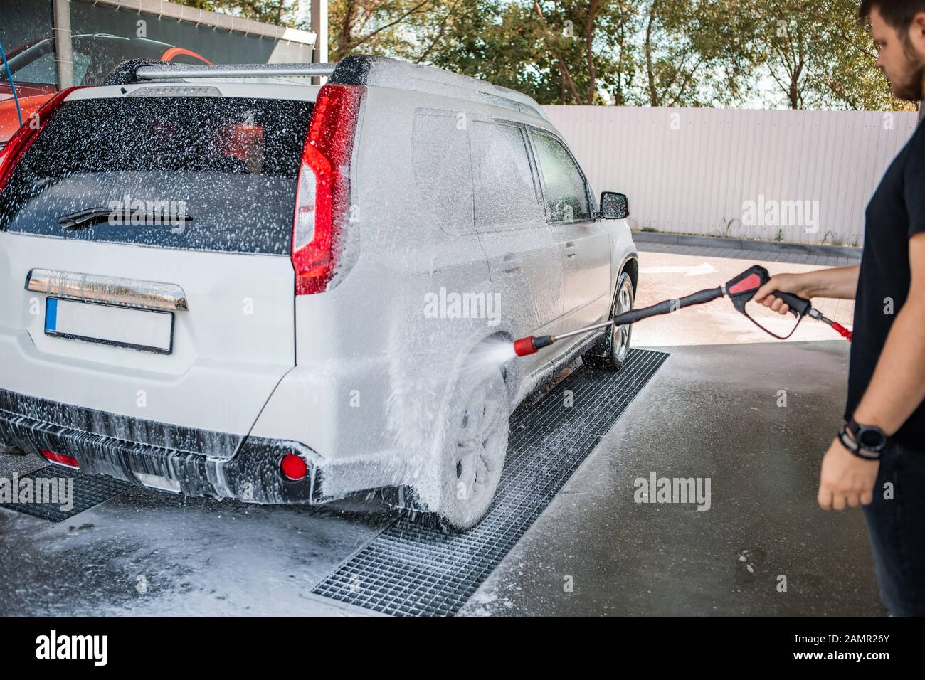 strong man washing car at self carwash outdoors Stock Photo - Alamy