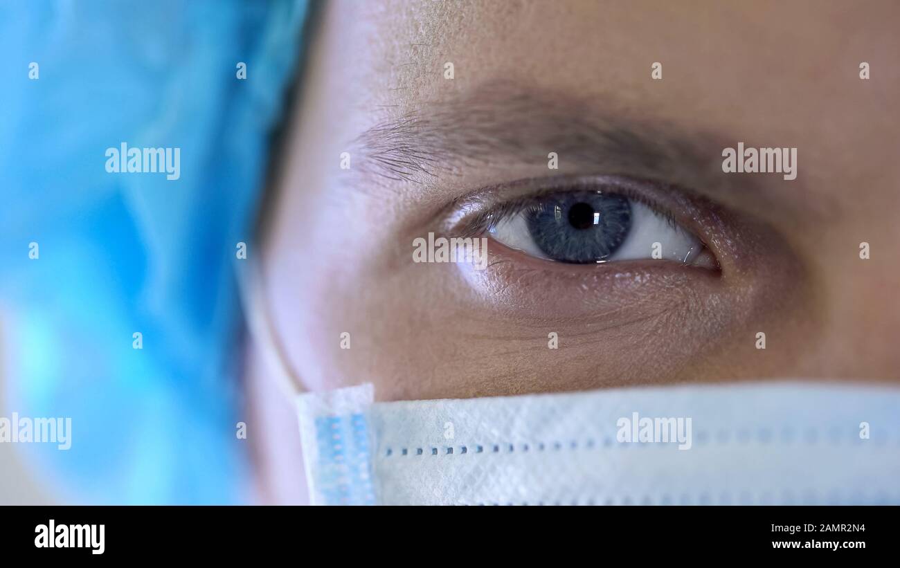 Doctors half face in mask, male therapist posing for camera, trust in ...