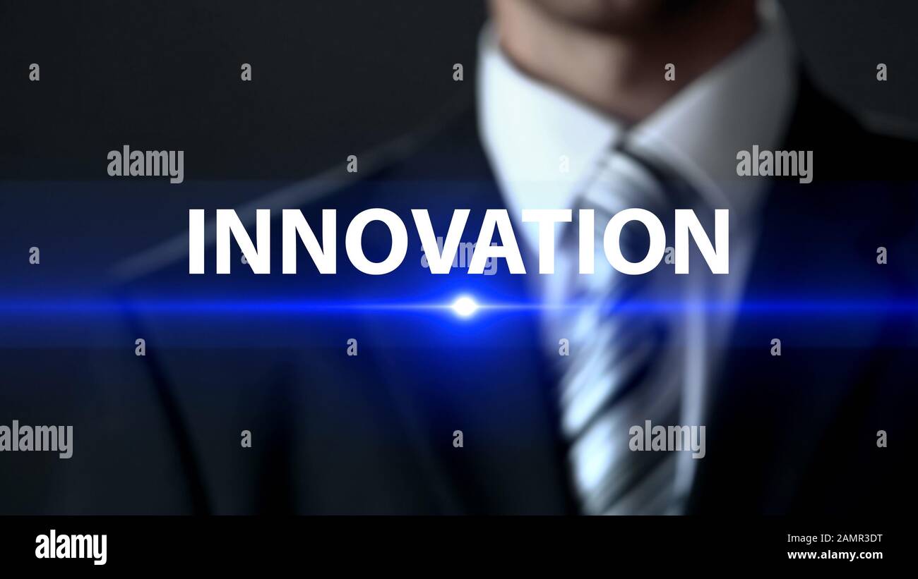 Innovation, man in business suit standing in front of screen ...