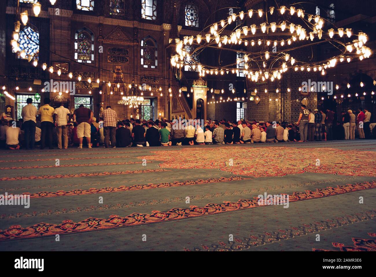 People praying inside the New Mosque Stock Photo - Alamy