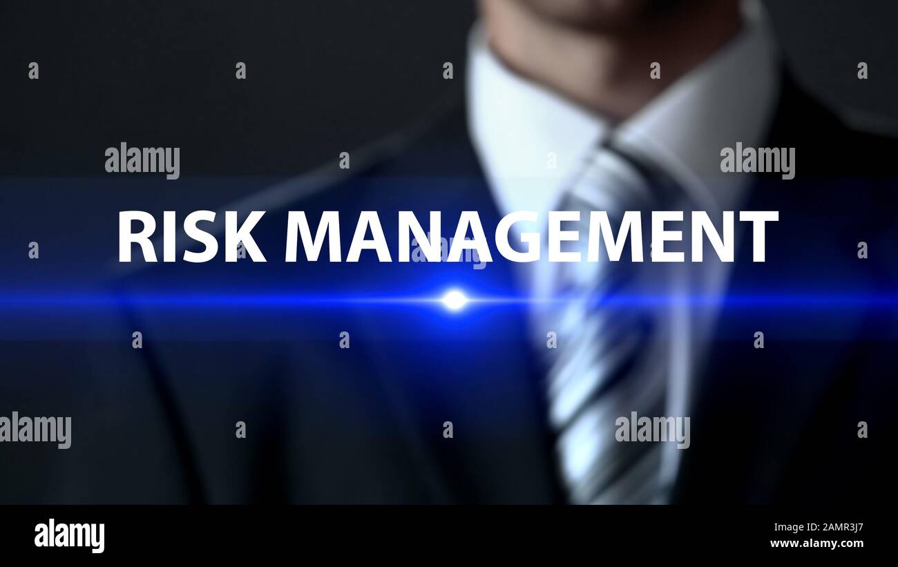 Risk management, businessman in suit standing in front of screen ...