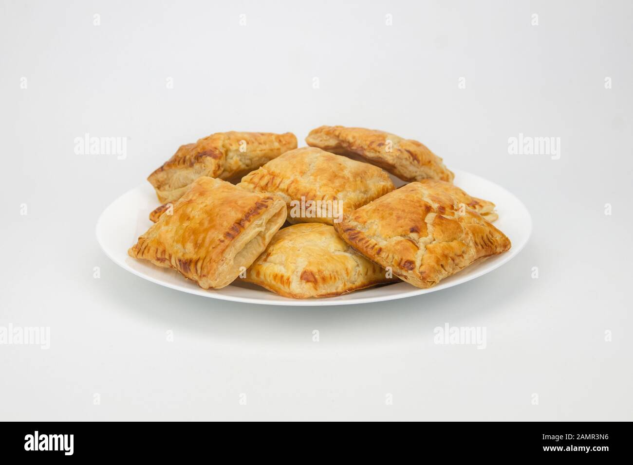 Guava puff pastry on a plate isolated in white background.Groups of ...