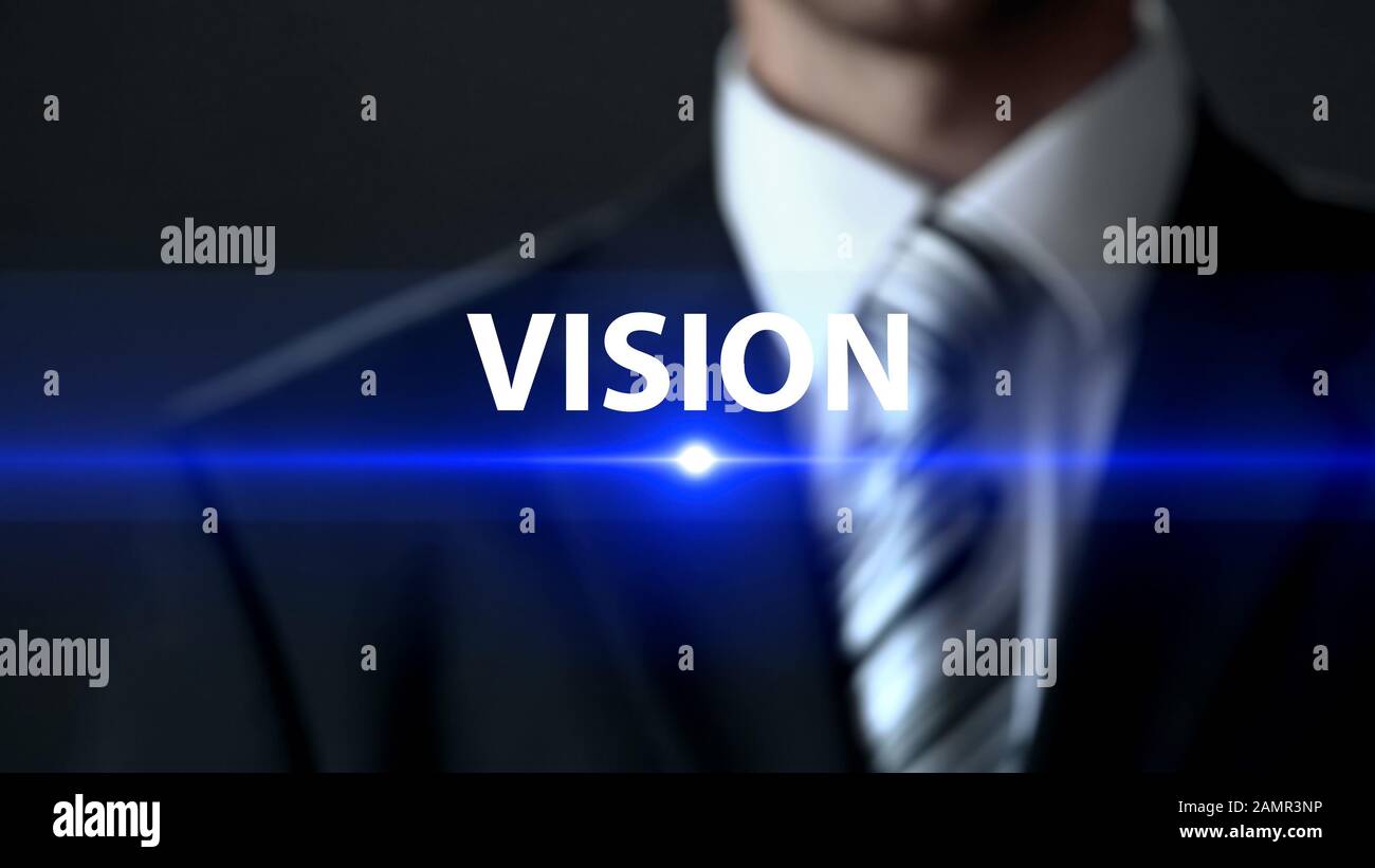 Vision, male in suit standing in front of screen, development strategy ...