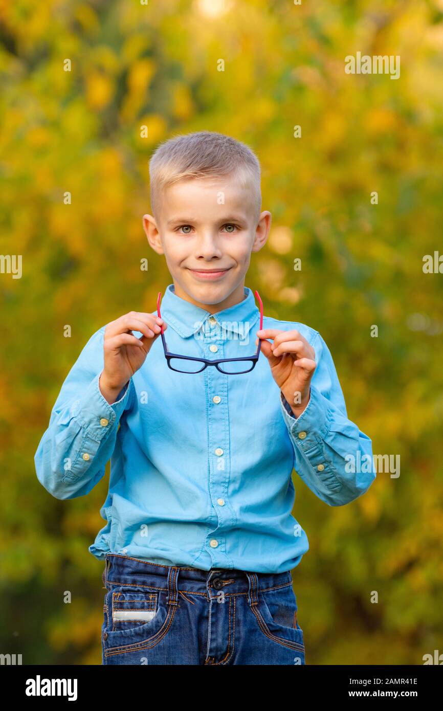 Boy taking off shirt hi-res stock photography and images - Alamy