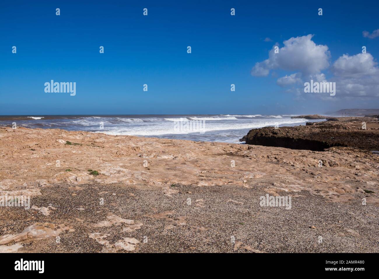 Rocky part of the coast and beach of the Atlantic ocean. Waves in the ...