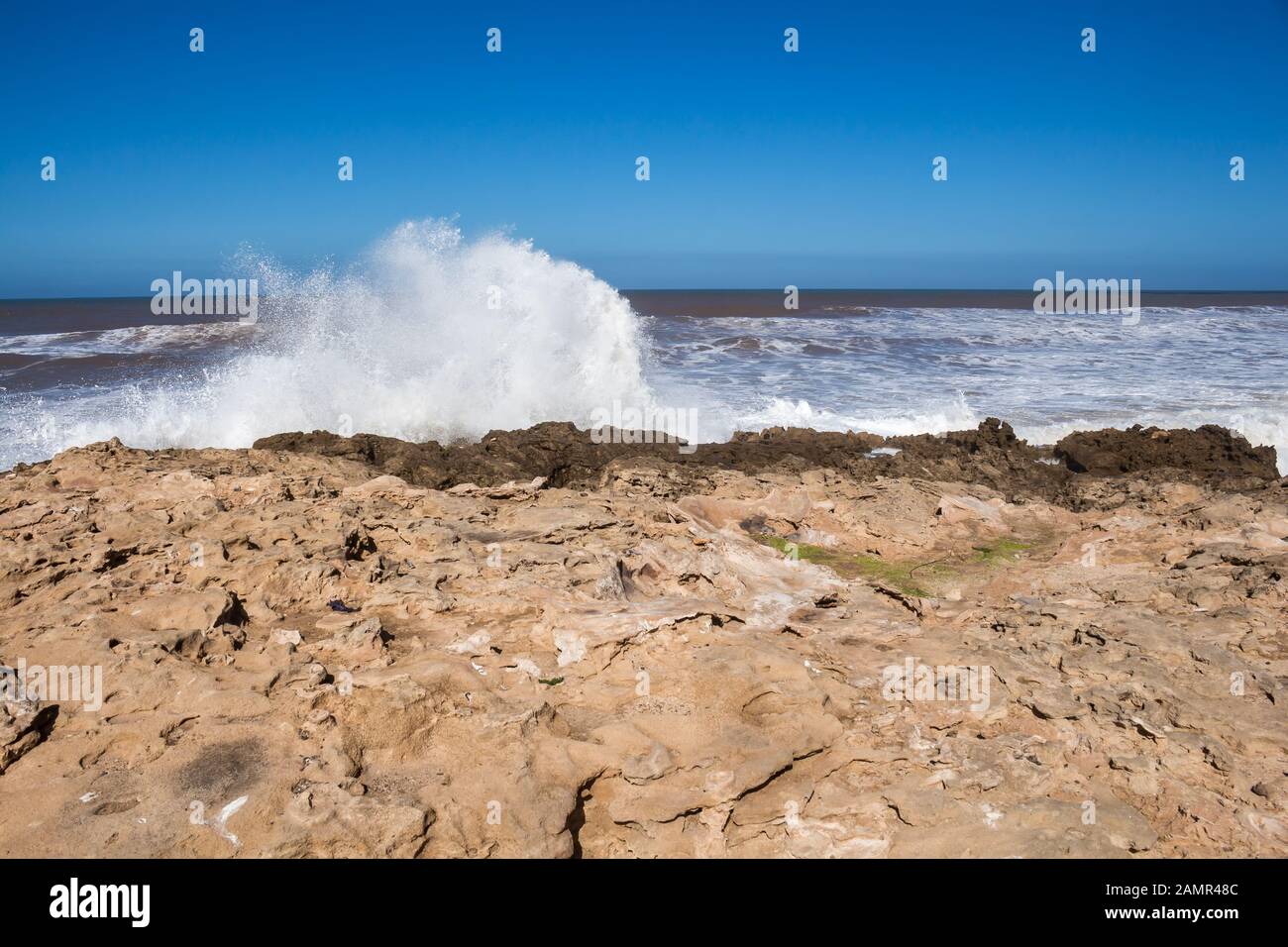 Rocky part of the coast and beach of the Atlantic ocean. Waves in the ...