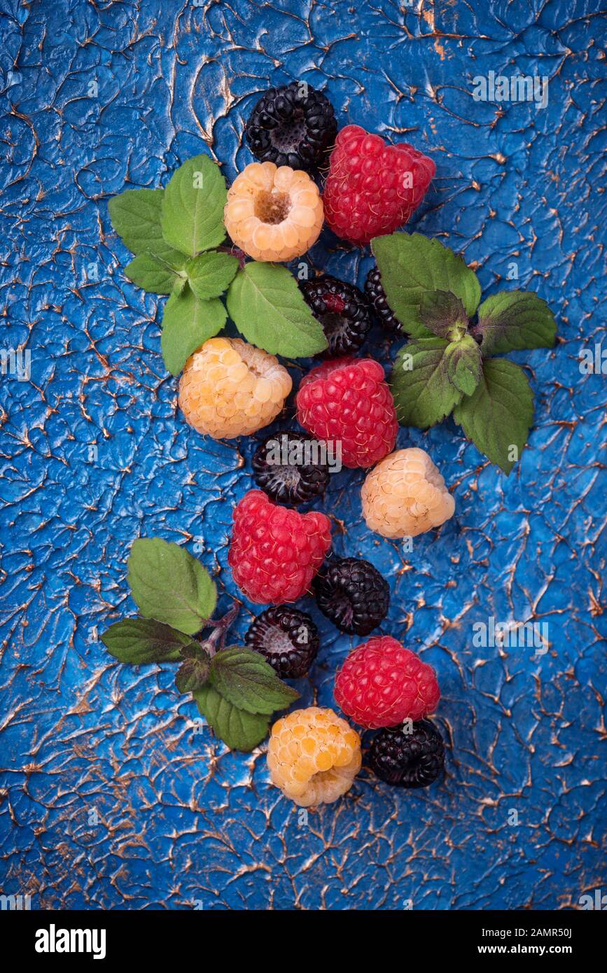 Red, black and yellow raspberry Stock Photo - Alamy