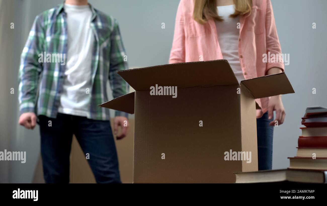 Angry man waiting for woman packing things and leaving home, treason ...