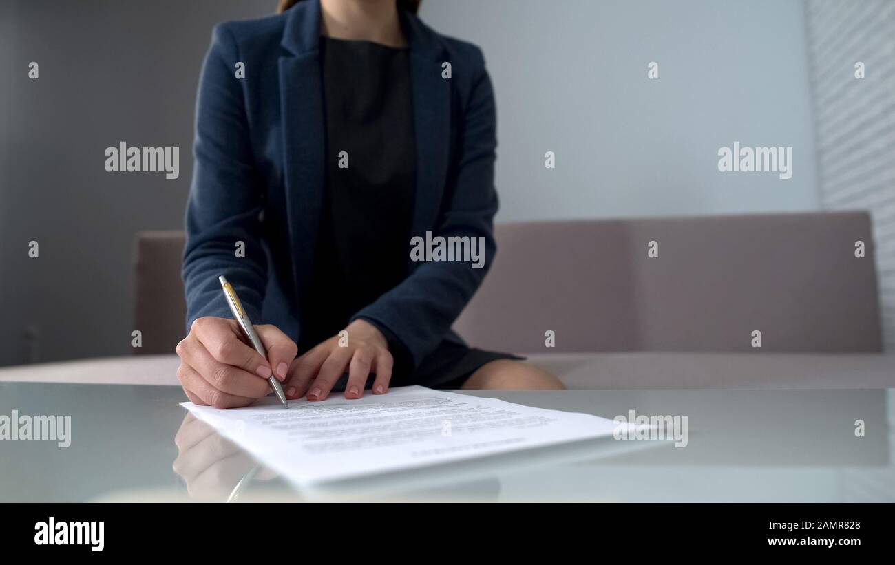 Woman signing documents receive money hi-res stock photography and ...