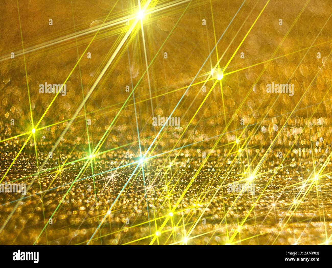Diamond shine on a golden background Stock Photo - Alamy